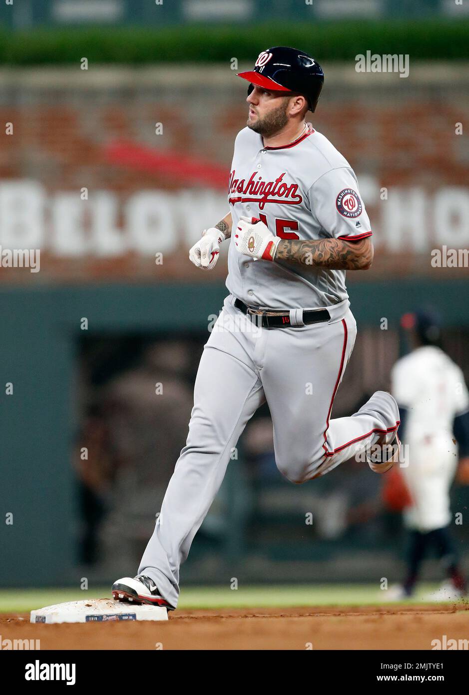 Washington Nationals first baseman Matt Adams (15) rounds second base ...