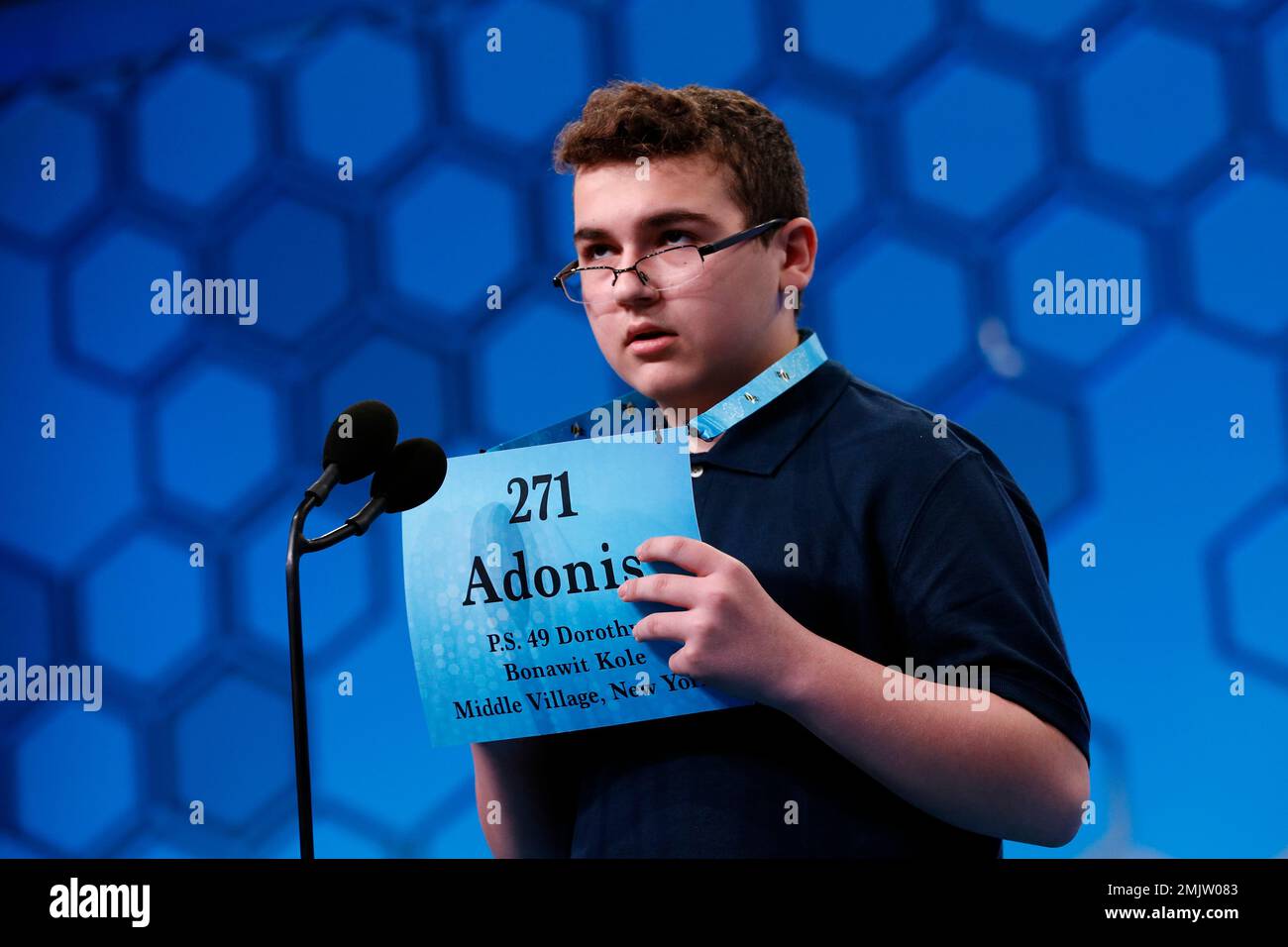Adonis Cusu, 13, of Glendale, N.Y., competes in the third round of the ...