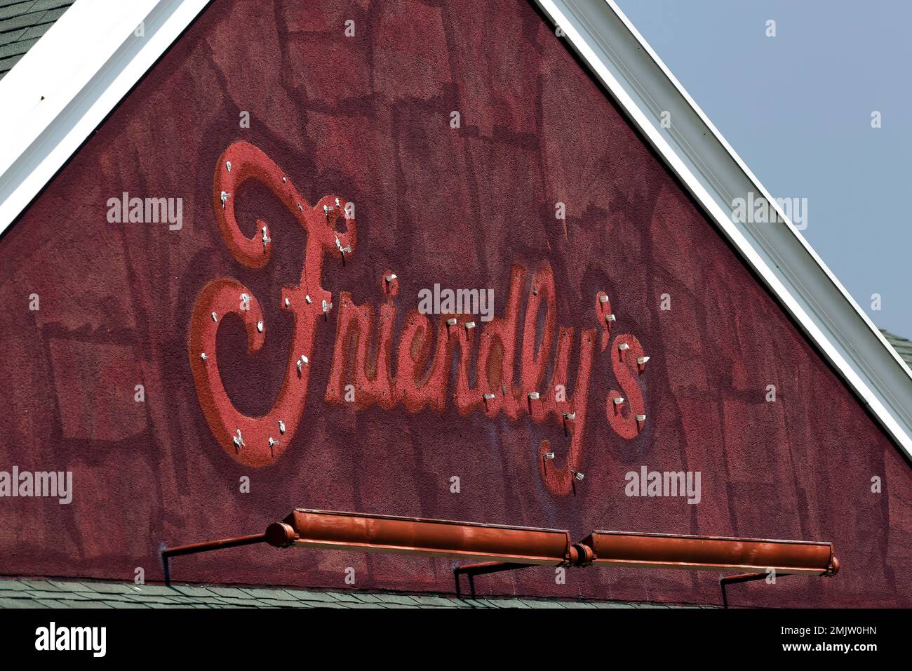 A fading sign at an out-of-business Friendly's restaurant is seen ...