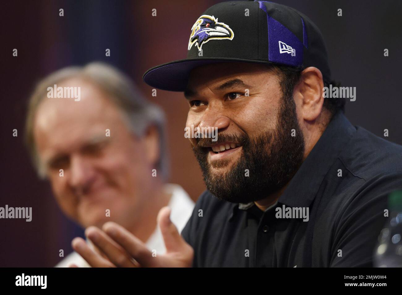 Former Baltimore Ravens NFL football player Haloti Ngata, right, speaks ...