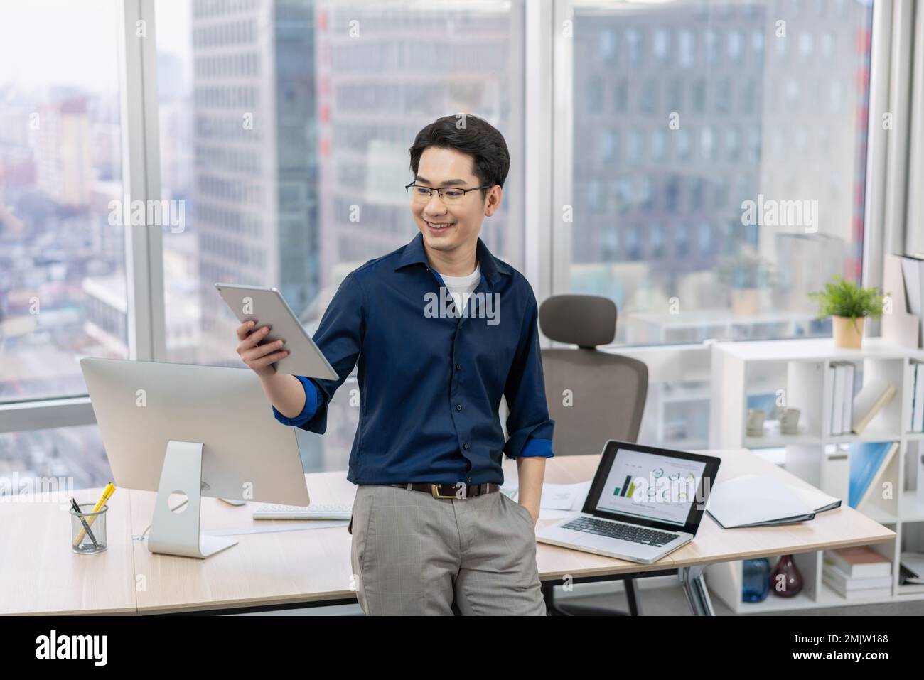 A young business man work in the office Stock Photo - Alamy