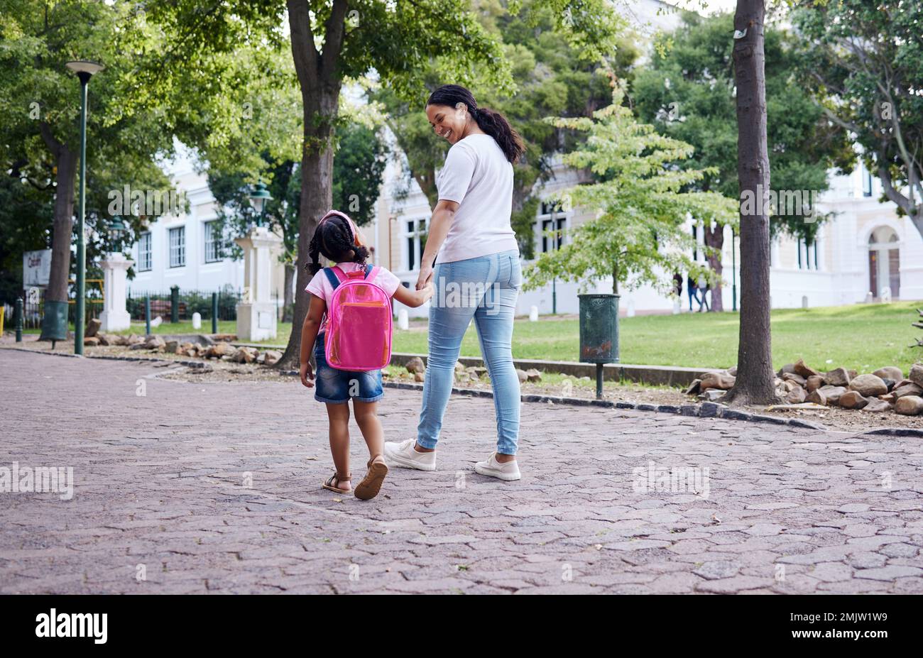 Kindergarten, student and mother with daughter walking to school, relax and bonding while ...