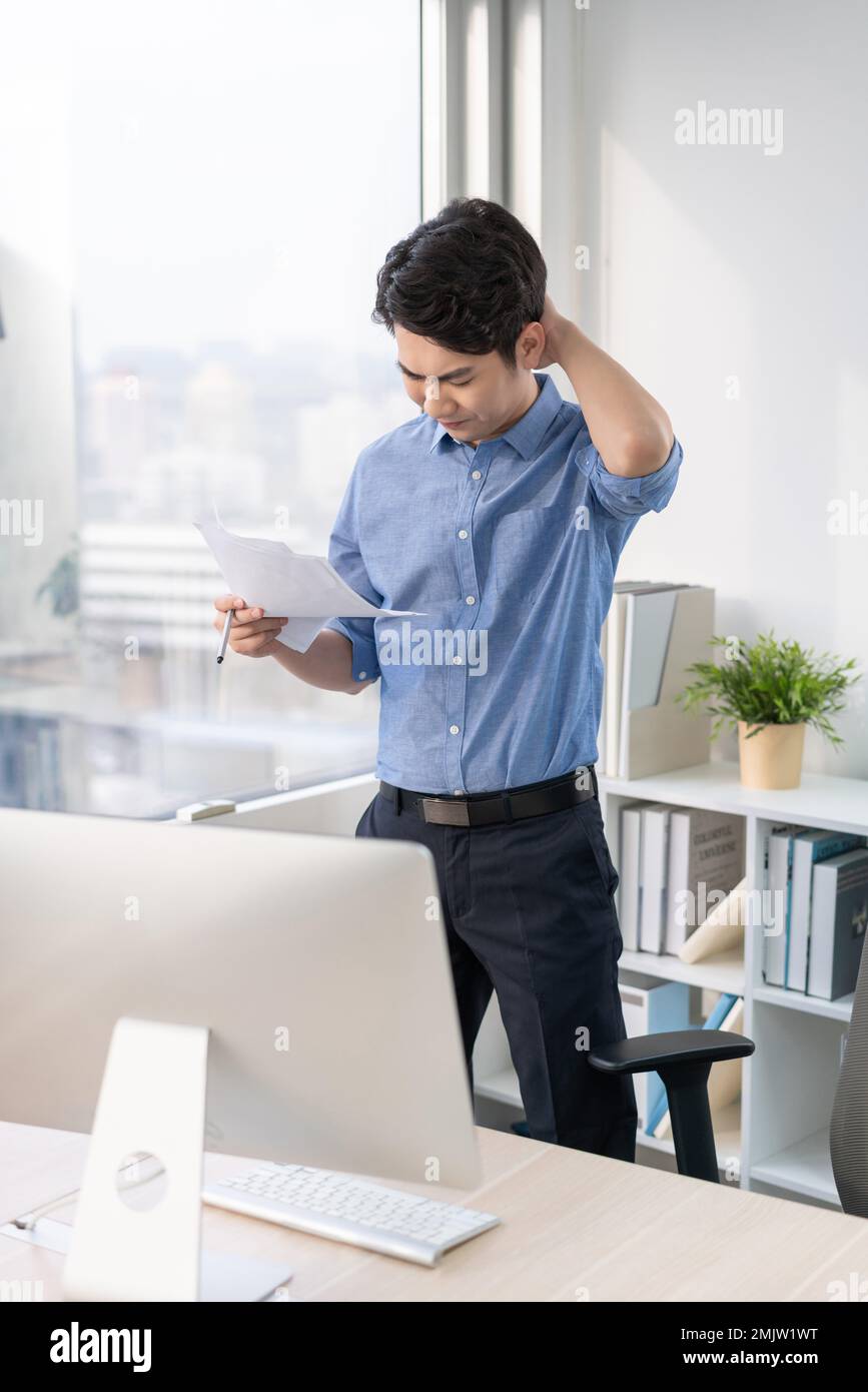 A young business man work in the office Stock Photo - Alamy