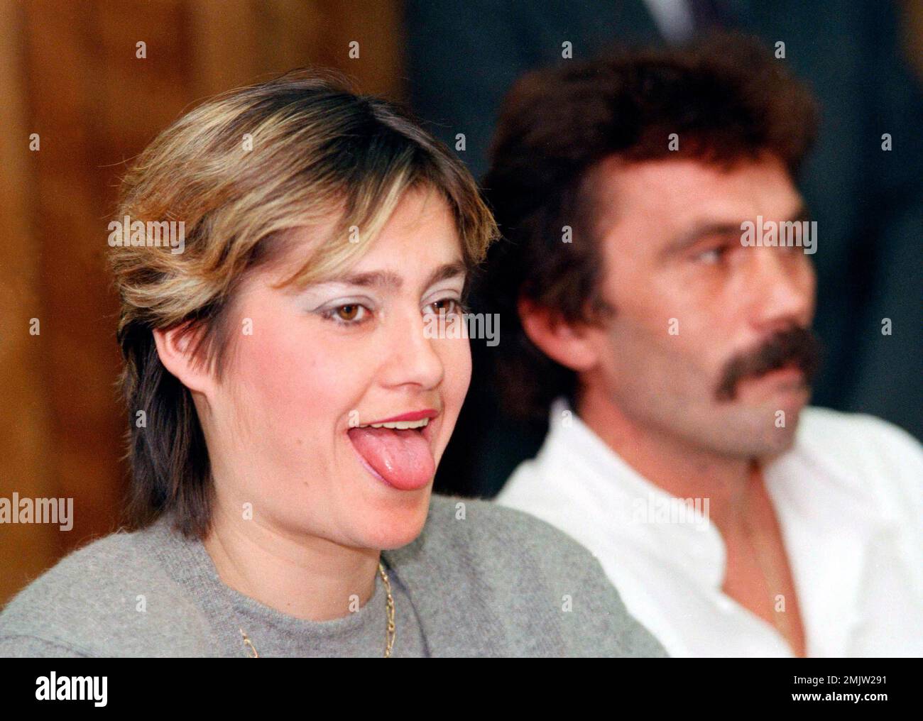 Romanian gymnast Nadia Comaneci sticks out her tongue playfully at a ...