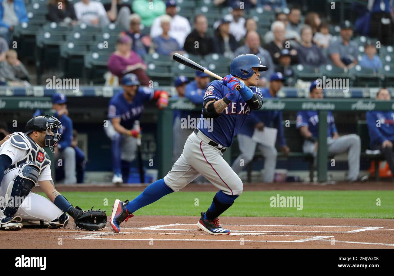 Texas Rangers' Shin-Soo Choo follows through on a single during the ...