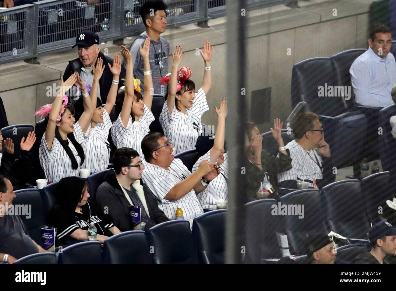 Members of the Japanese pop group Momoiro Clover Z dance before the ...