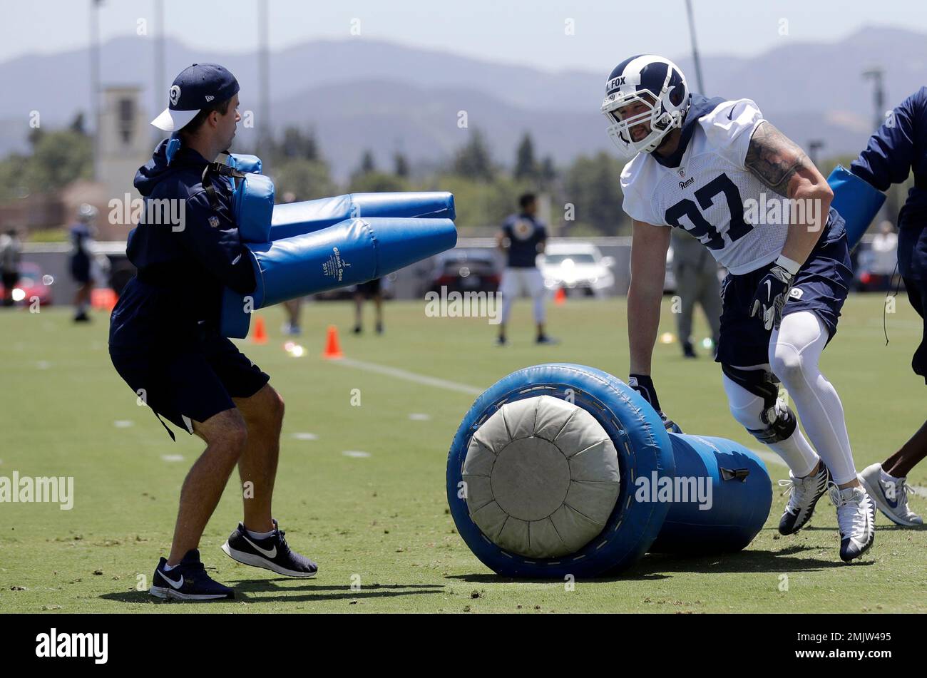 Los Angeles Rams defensive end Morgan Fox (97) goes through drills ...