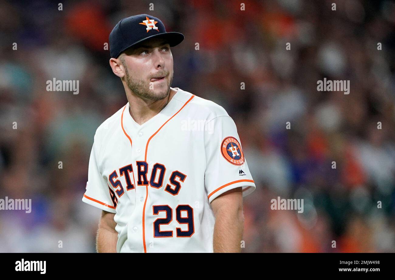 Houston Astros starting pitcher Corbin Martin looks at the scoreboard ...