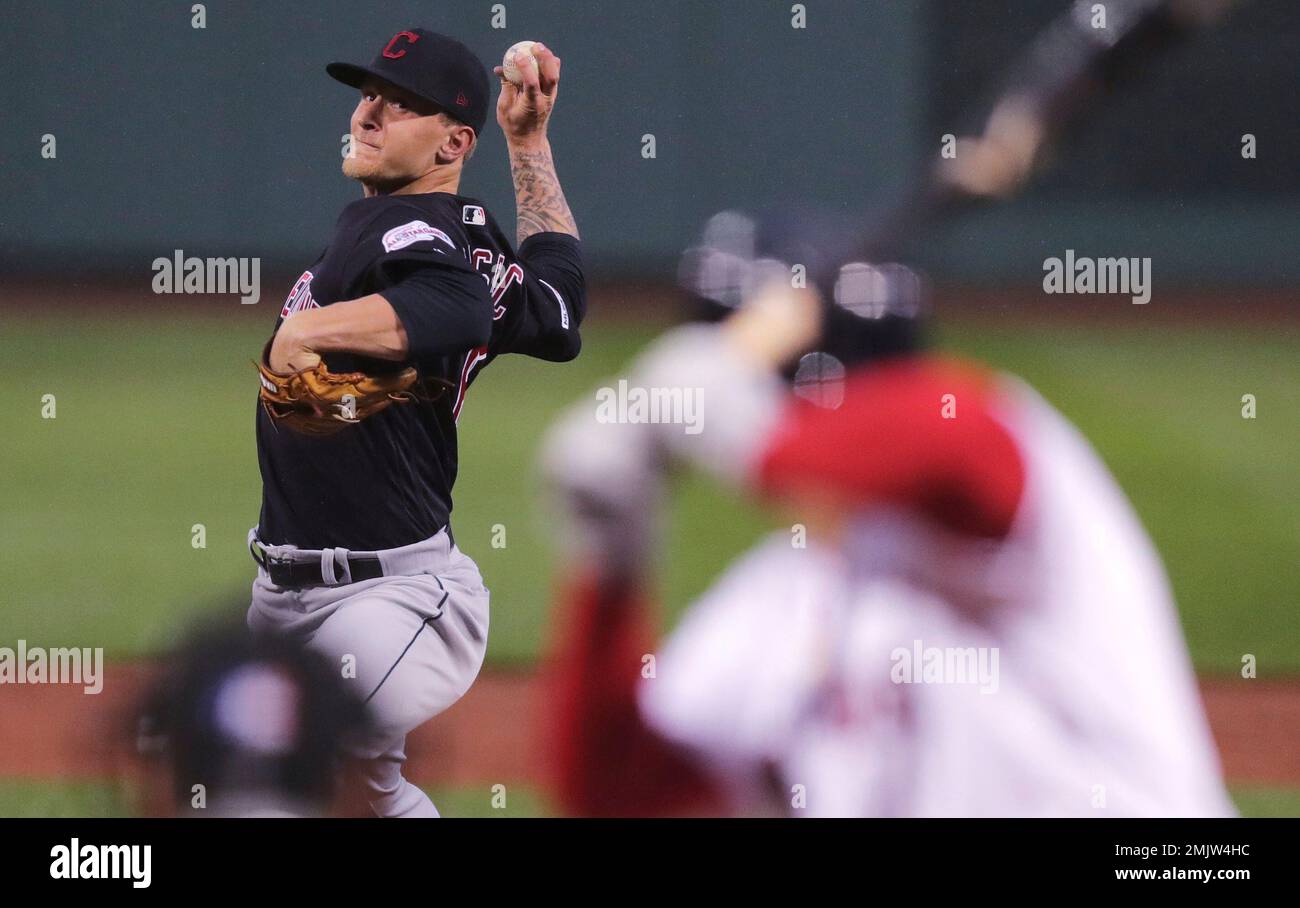 Cleveland Indians starting pitcher Zach Plesac delivers during the first inning of a baseball ...