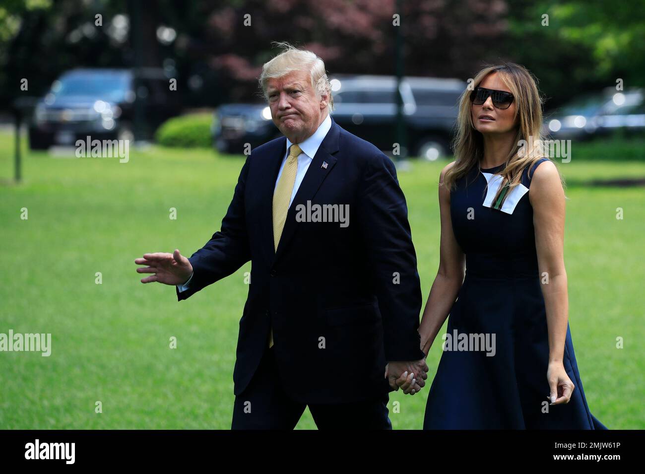 President Donald Trump with first lady Melania Trump arrive at the ...