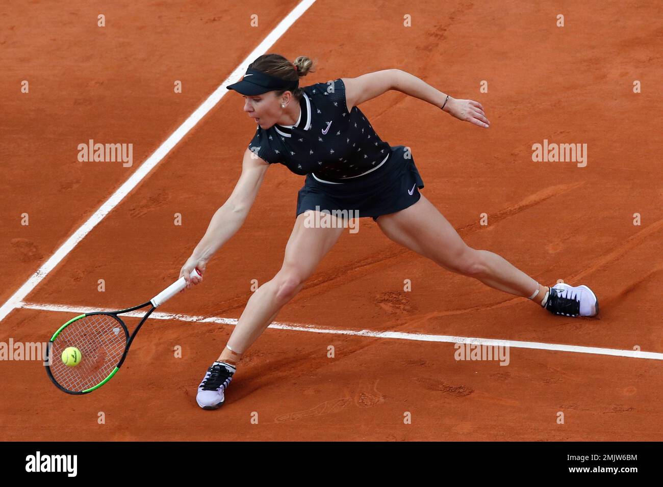 Romania's Simona Halep plays a shot against Australia's Aila ...