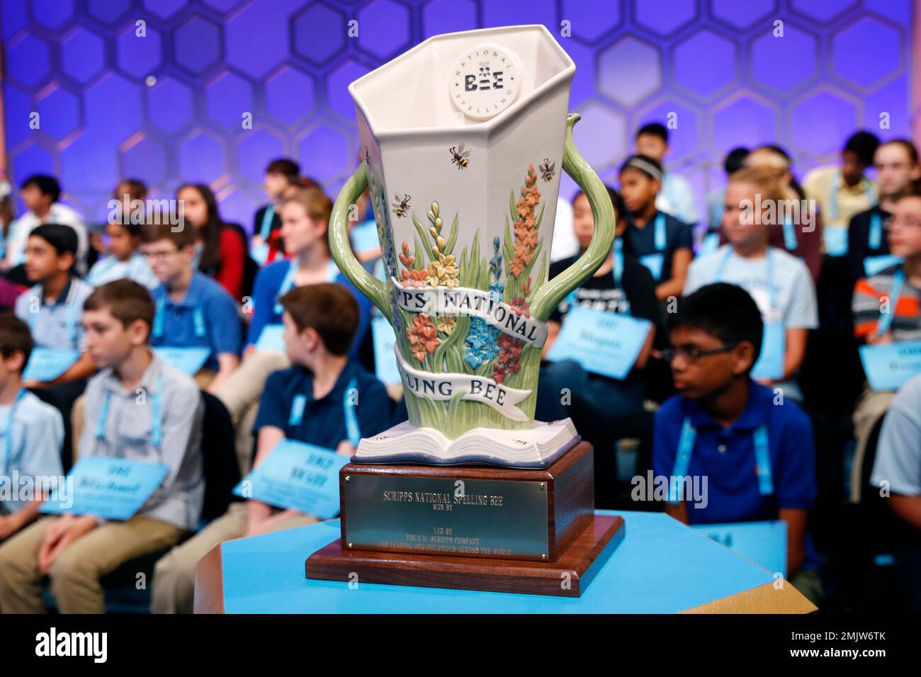 The Scripps National Spelling Bee trophy sits in front of competitors ...