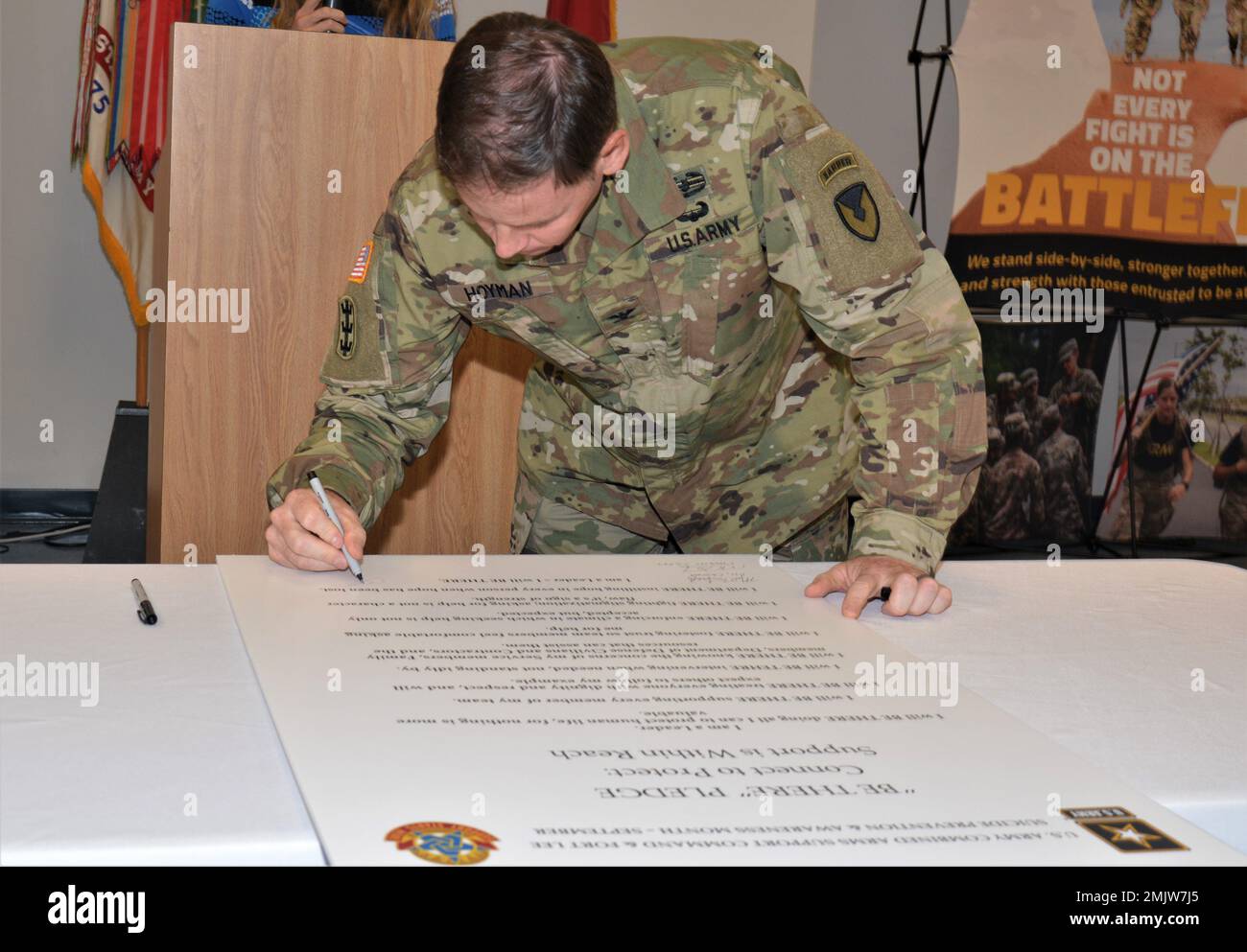 Col. James D. Hoyman, Fort Lee garrison commander, signs a Suicide ...