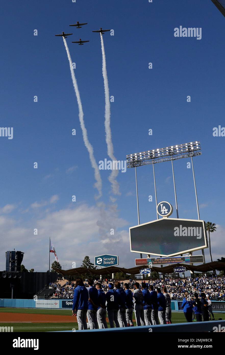 Planes fly over Dodger Stadium and members of the New York Mets on ...