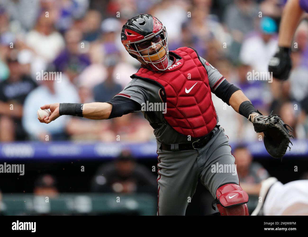 Arizona Diamondbacks catcher Alex Avila throws to first base to put out ...