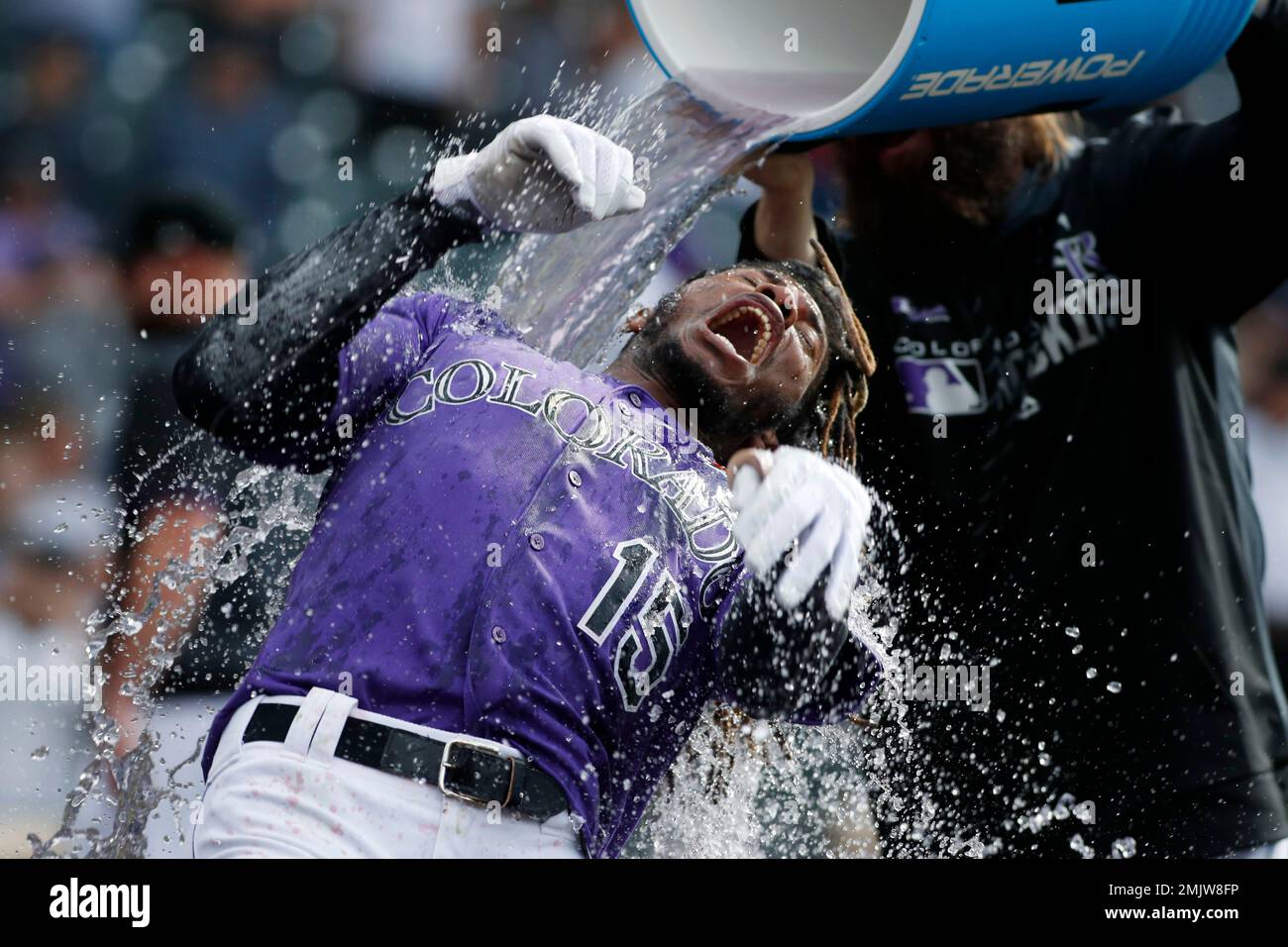Colorado Rockies' Charlie Blackmon, right, douses Raimel Tapia (15 ...