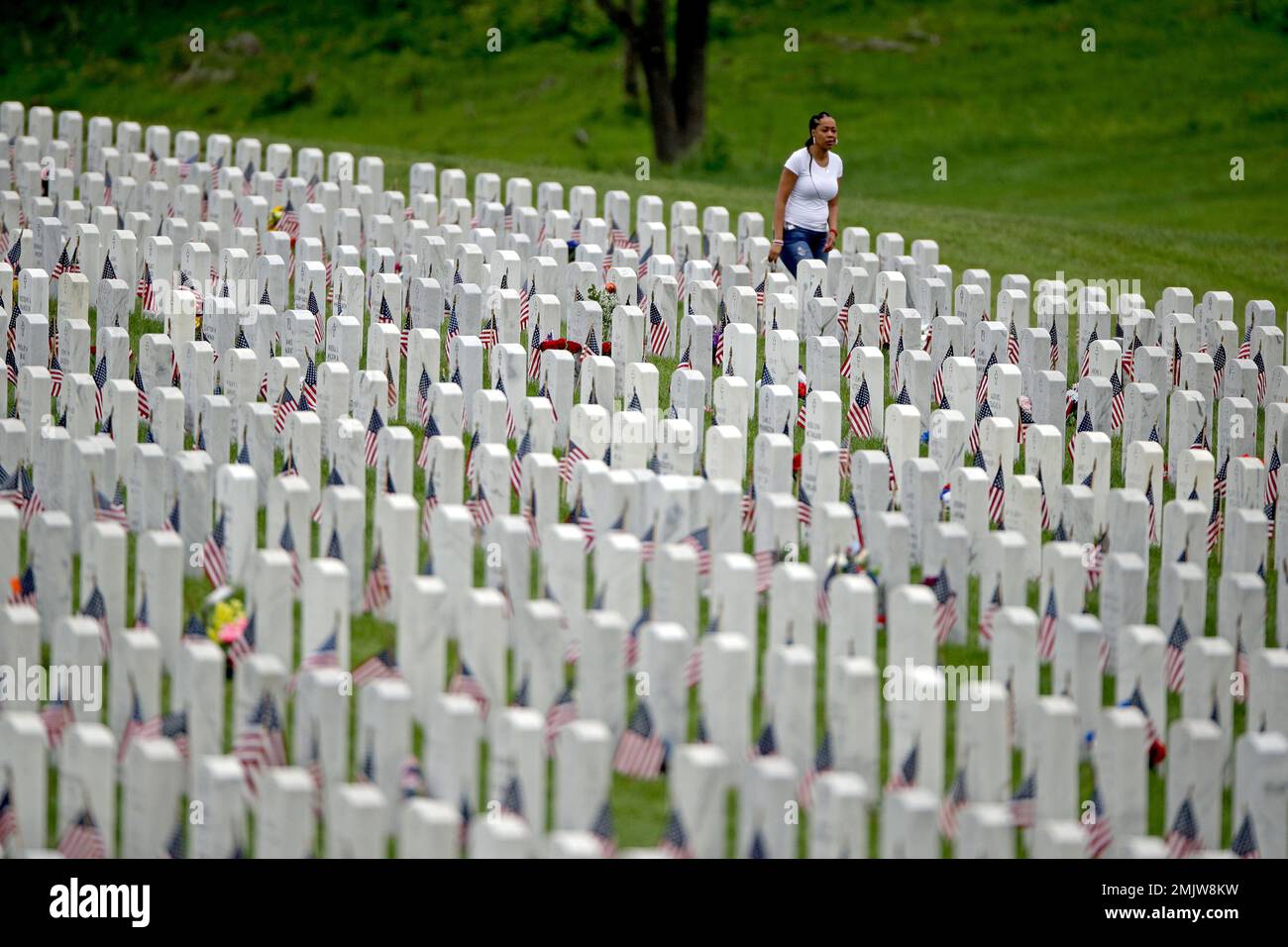 A woman looks for a grave on Memorial Day at Leavenworth National ...