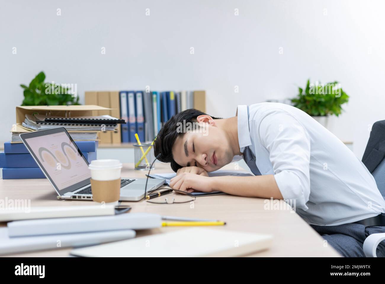 Business men in the office to work overtime Stock Photo - Alamy