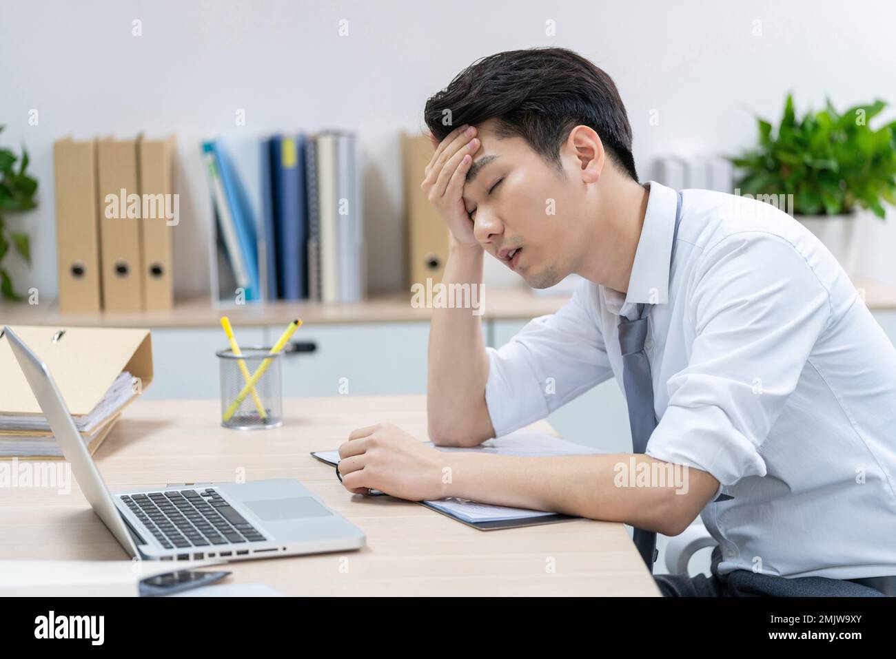 Business men in the office to work overtime Stock Photo - Alamy