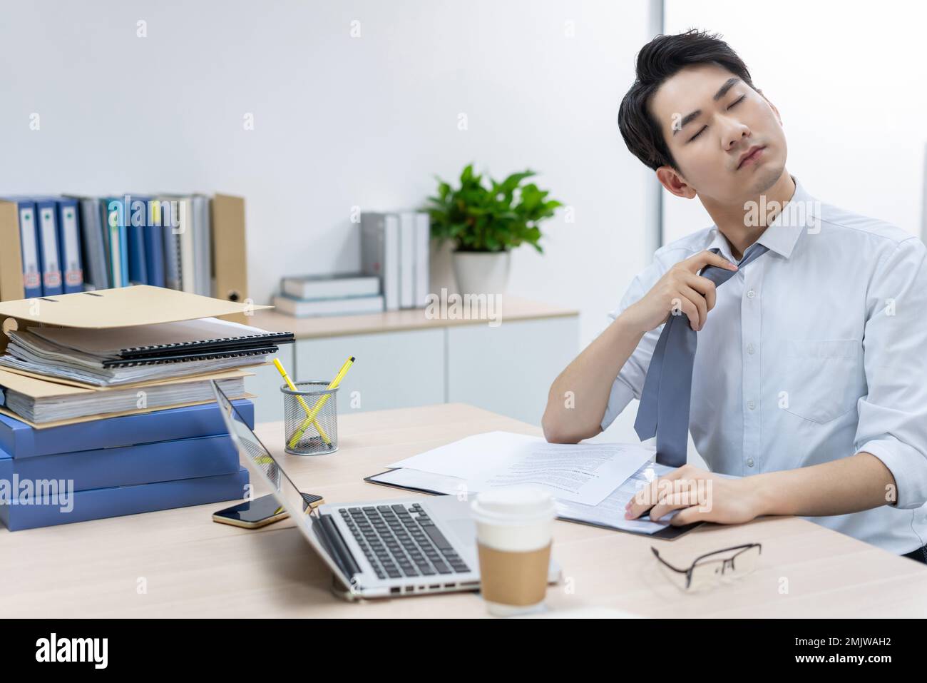 Business men in the office to work overtime Stock Photo - Alamy