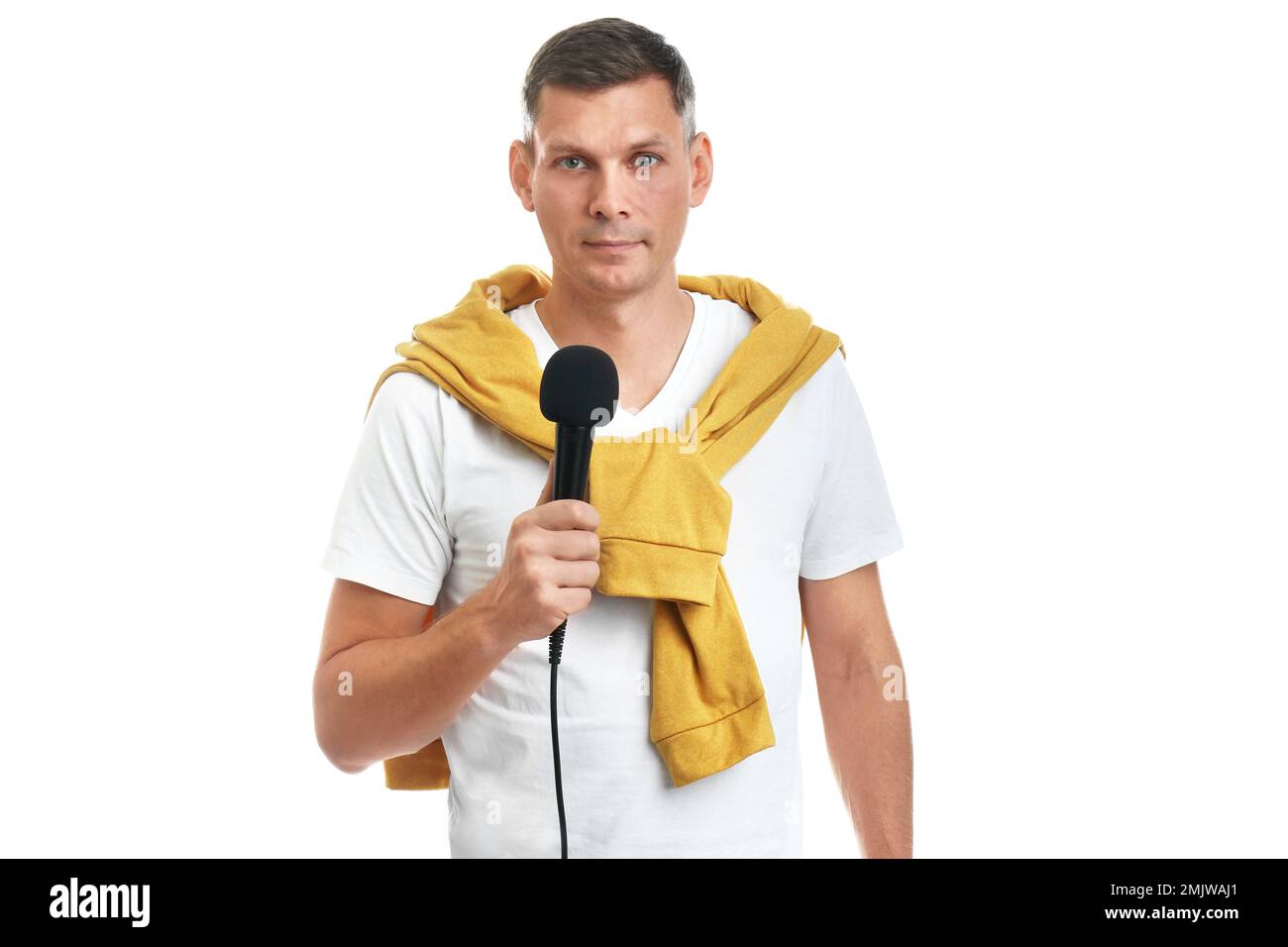 Male journalist with microphone on white background Stock Photo - Alamy
