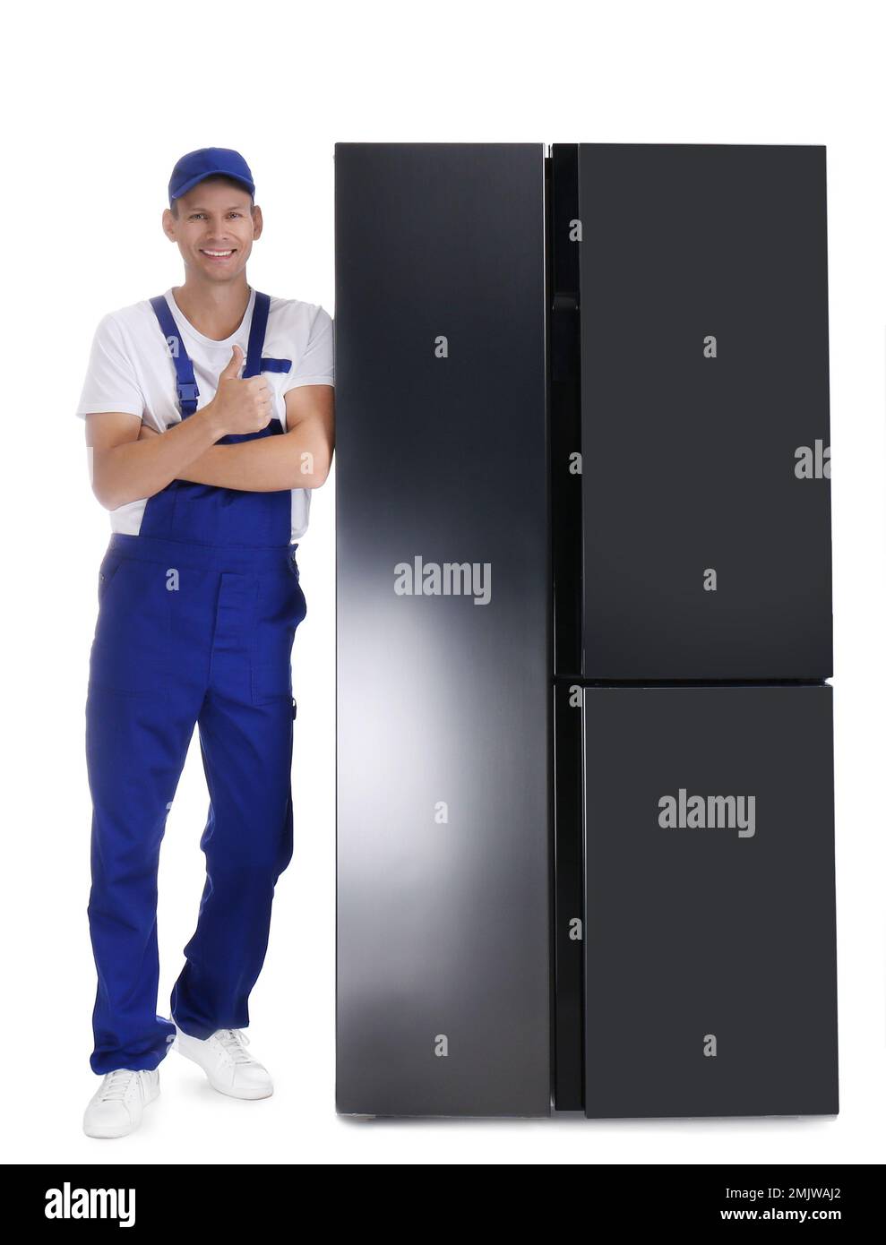 Professional worker near refrigerator on white background Stock Photo ...