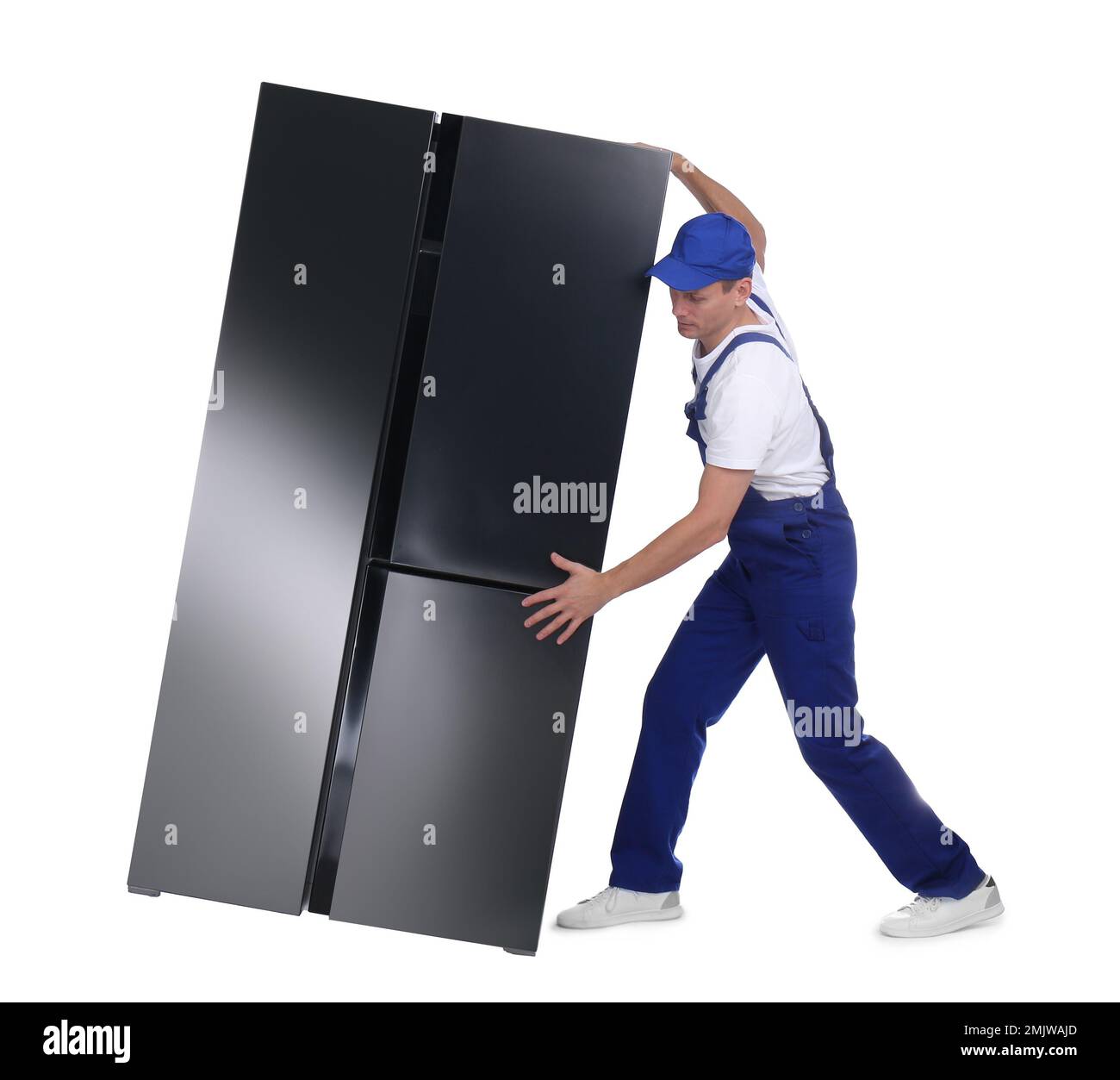 Professional worker carrying refrigerator on white background Stock ...