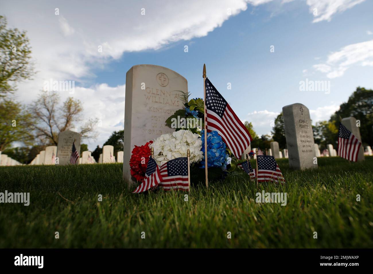Flowers and flags mark the gravestone of U.S. Army Sgt. Maj. Glenn A ...