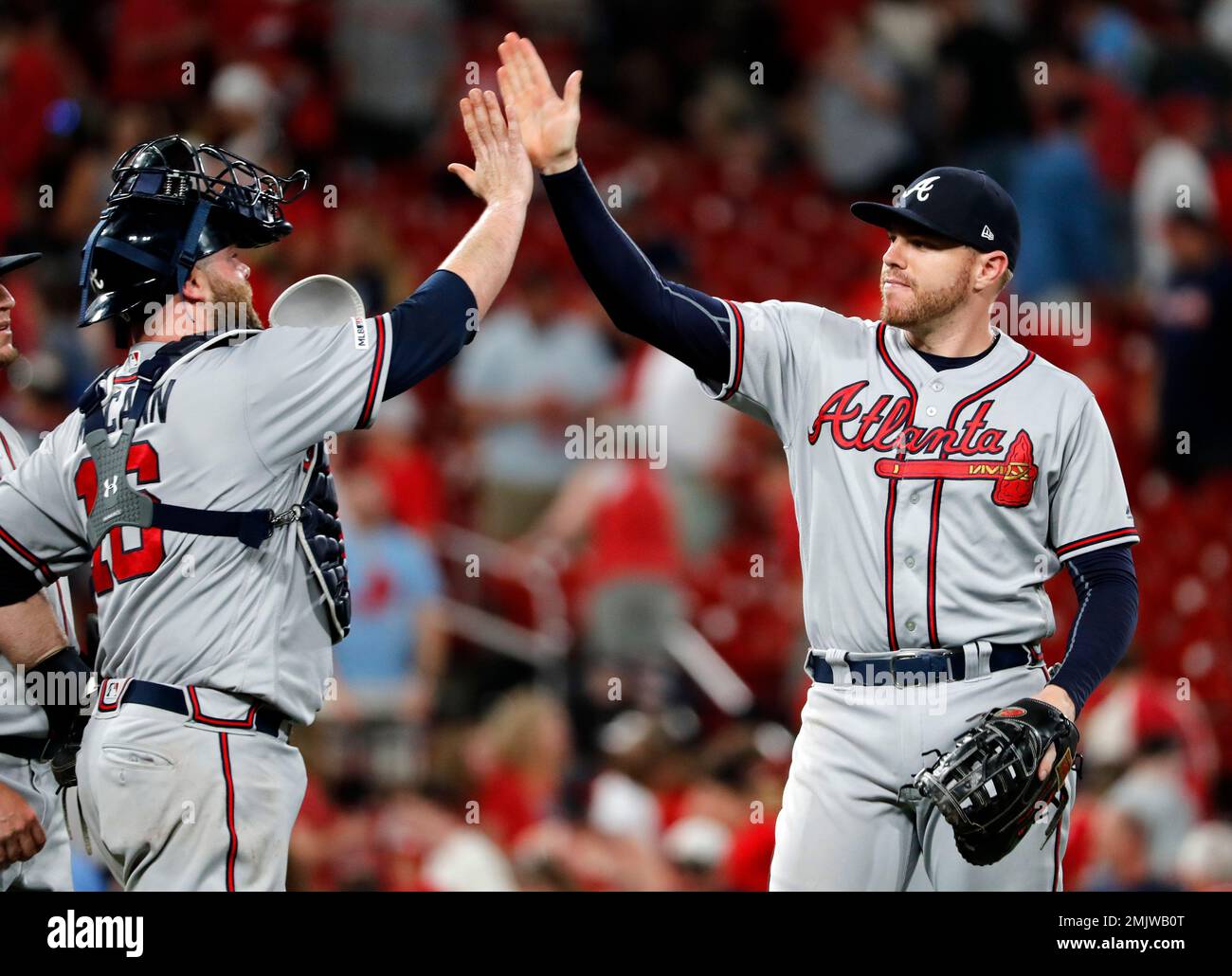 Atlanta Braves' Freddie Freeman, right, and Brian McCann celebrate a 4 ...