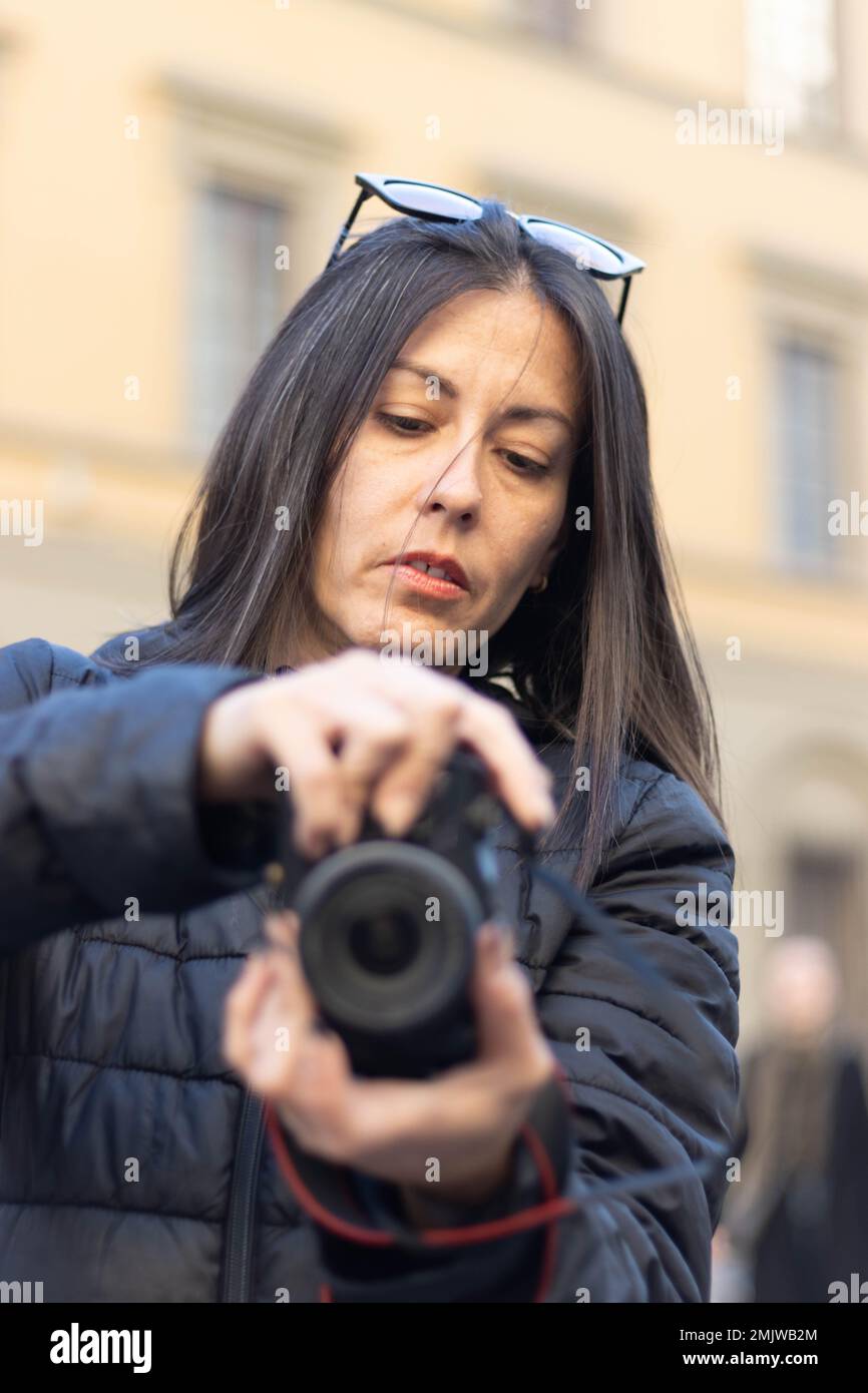 Portrait of photographer woman unfocused background at Florence, Italy ...