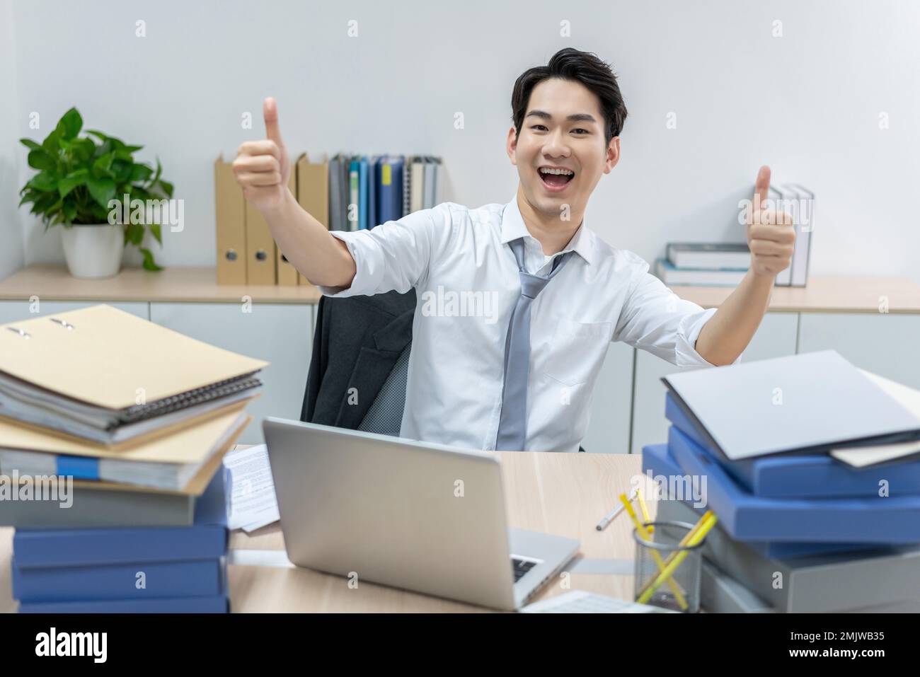 Happy business men in the office to work overtime Stock Photo - Alamy