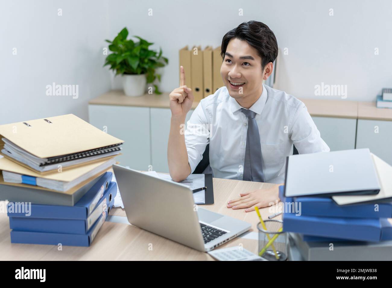 Happy business men in the office to work overtime Stock Photo - Alamy