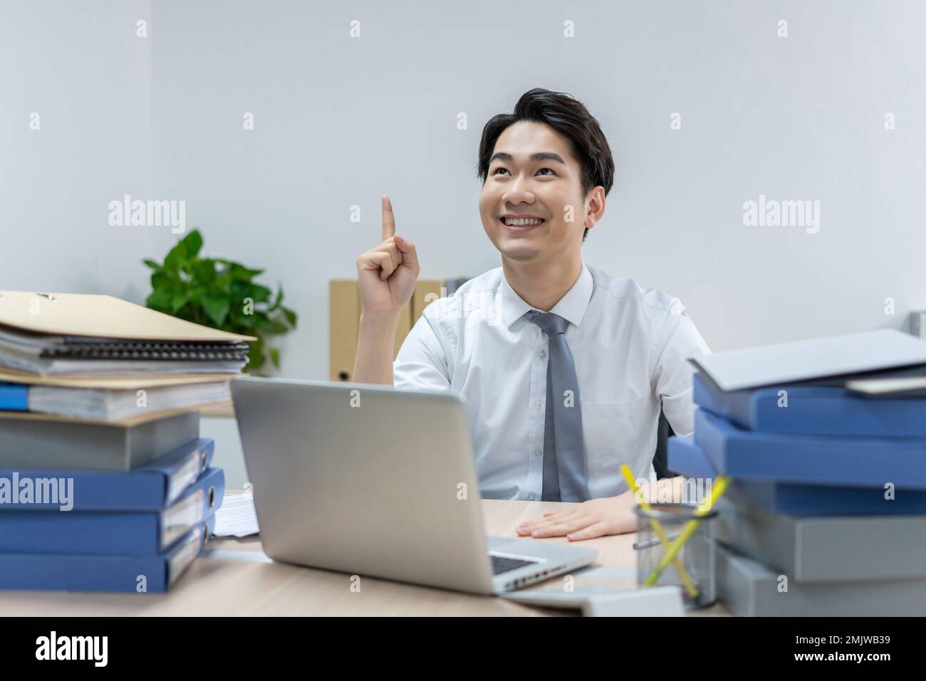 Happy business men in the office to work overtime Stock Photo - Alamy