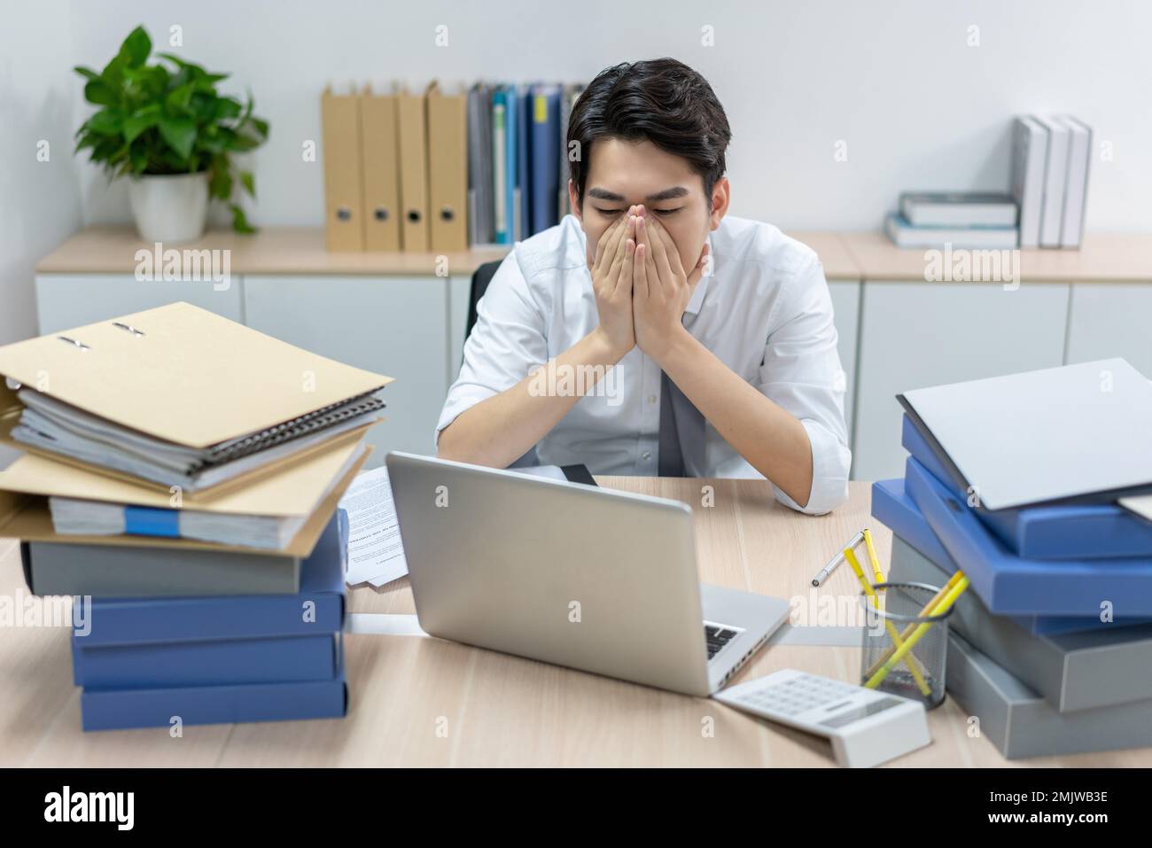 Business men in the office to work overtime Stock Photo - Alamy