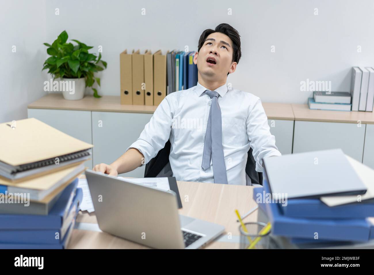 Business men in the office to work overtime Stock Photo - Alamy