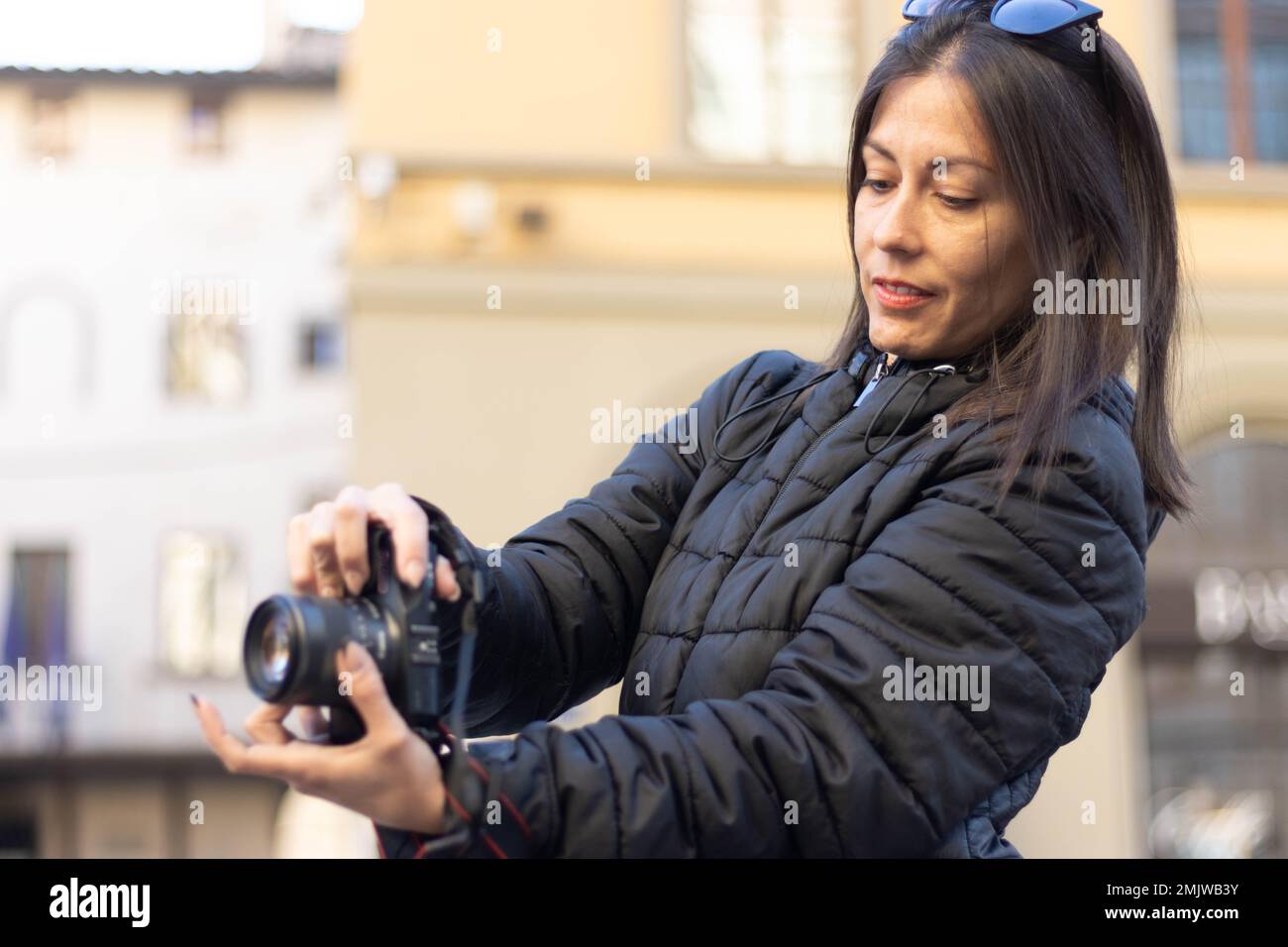 Portrait of photographer woman unfocused background at Florence, Italy ...