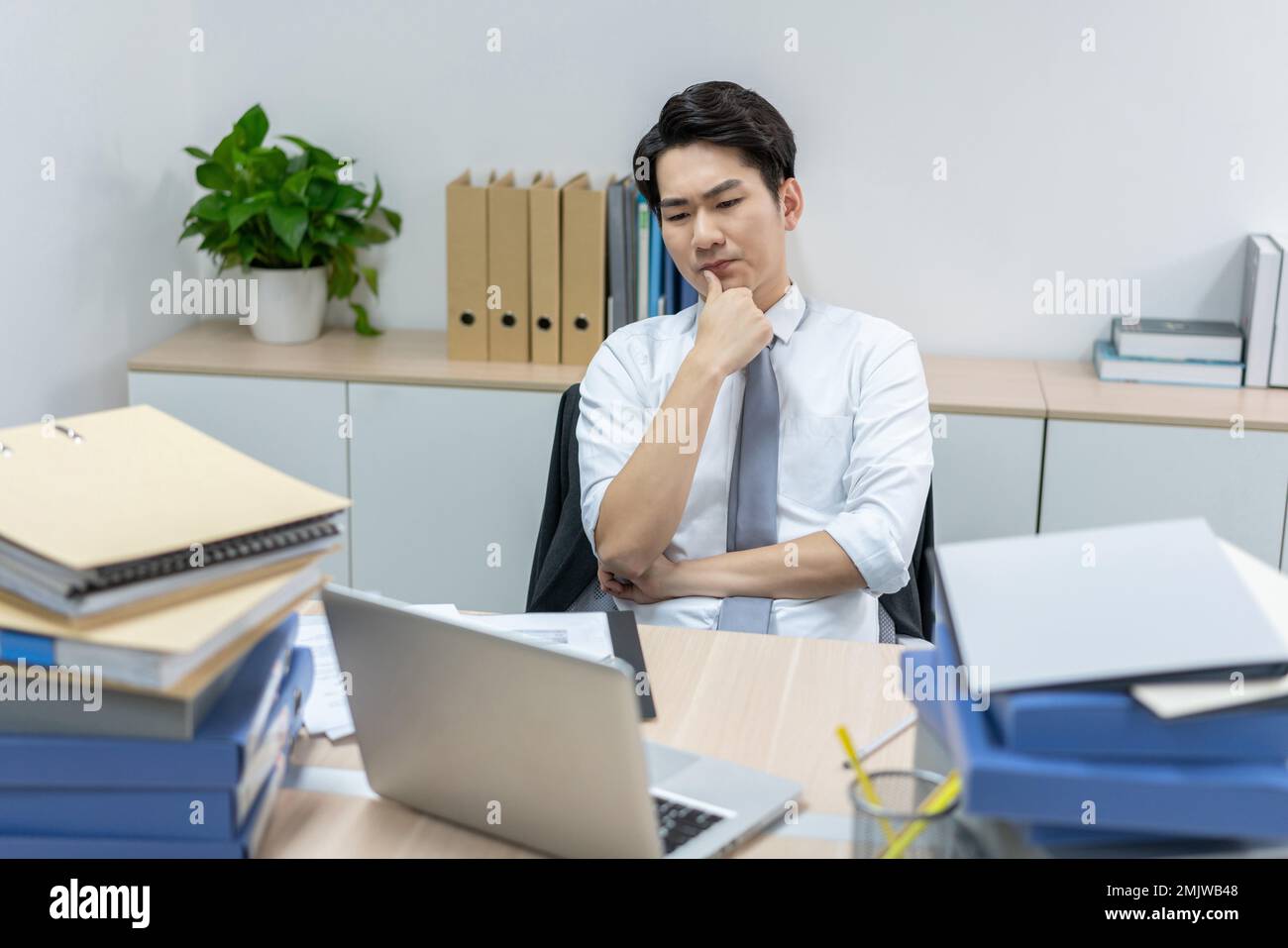 Business men in the office to work overtime Stock Photo - Alamy