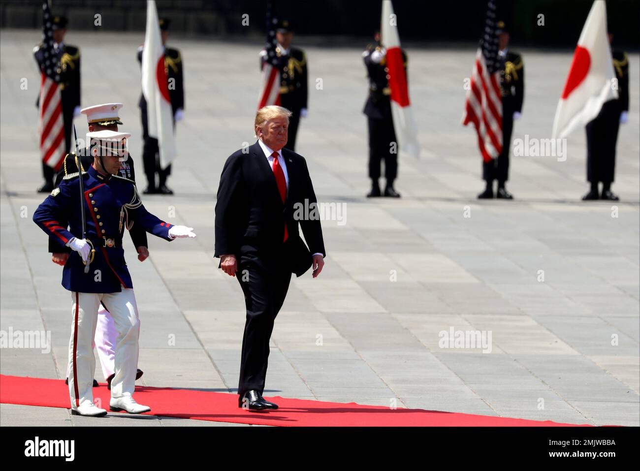 President Donald Trump walks during a welcome ceremony with Japanese ...