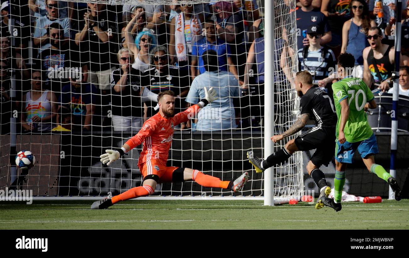 Sporting Kansas City forward Johnny Russell (7) gets the ball past ...