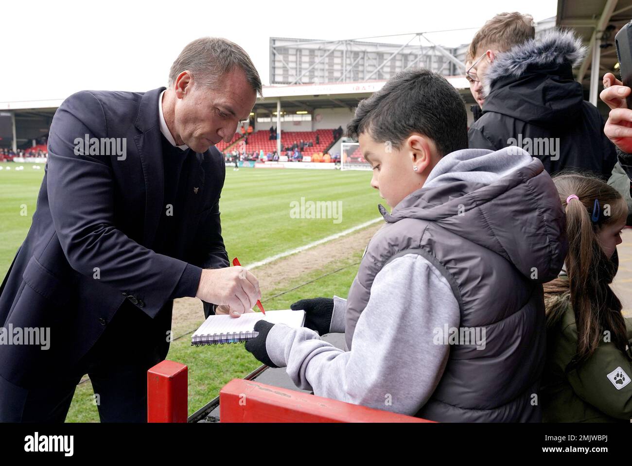 Leicester City manager Brendan Rodgers signing an autograph before the ...
