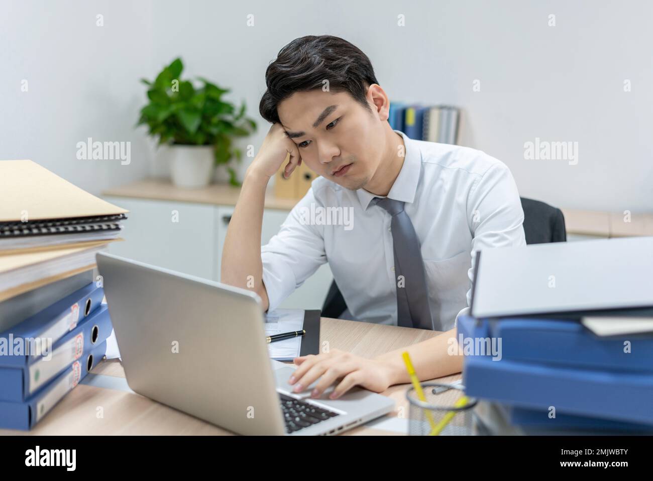 Business men in the office to work overtime Stock Photo - Alamy