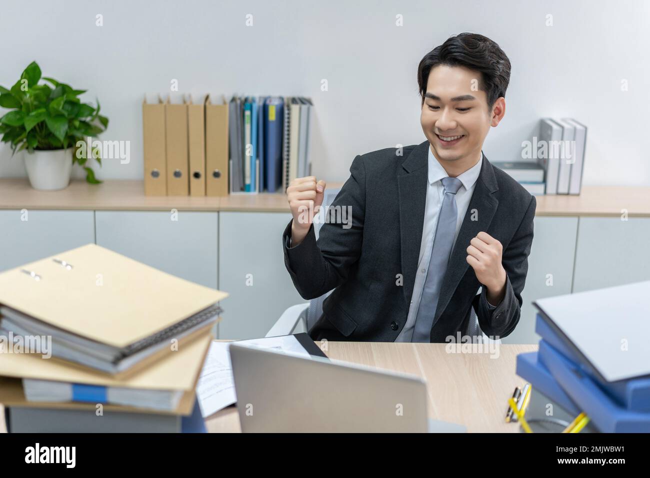 Happy business men in the office to work overtime Stock Photo - Alamy