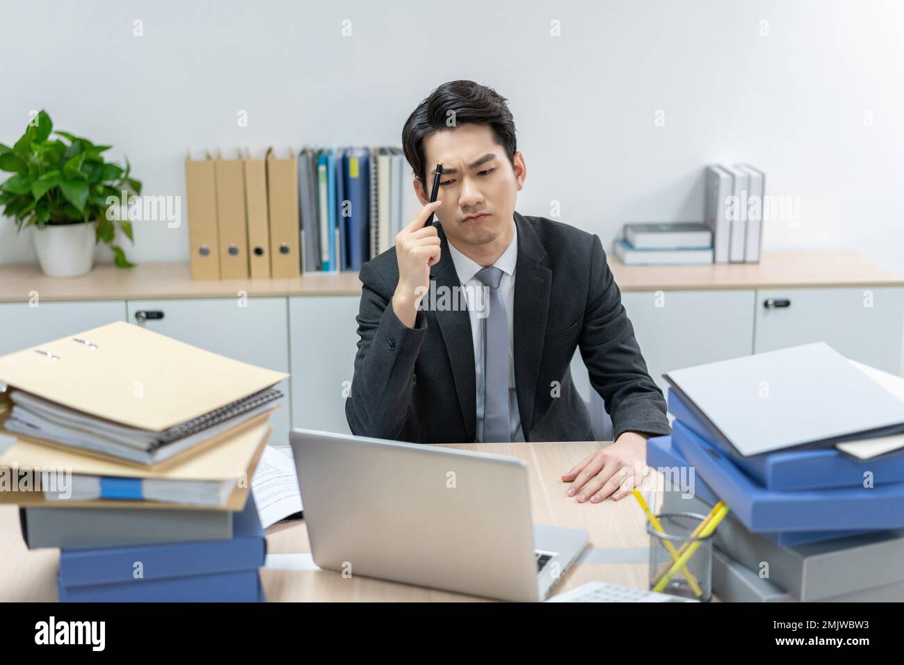 Business men in the office to work overtime Stock Photo - Alamy