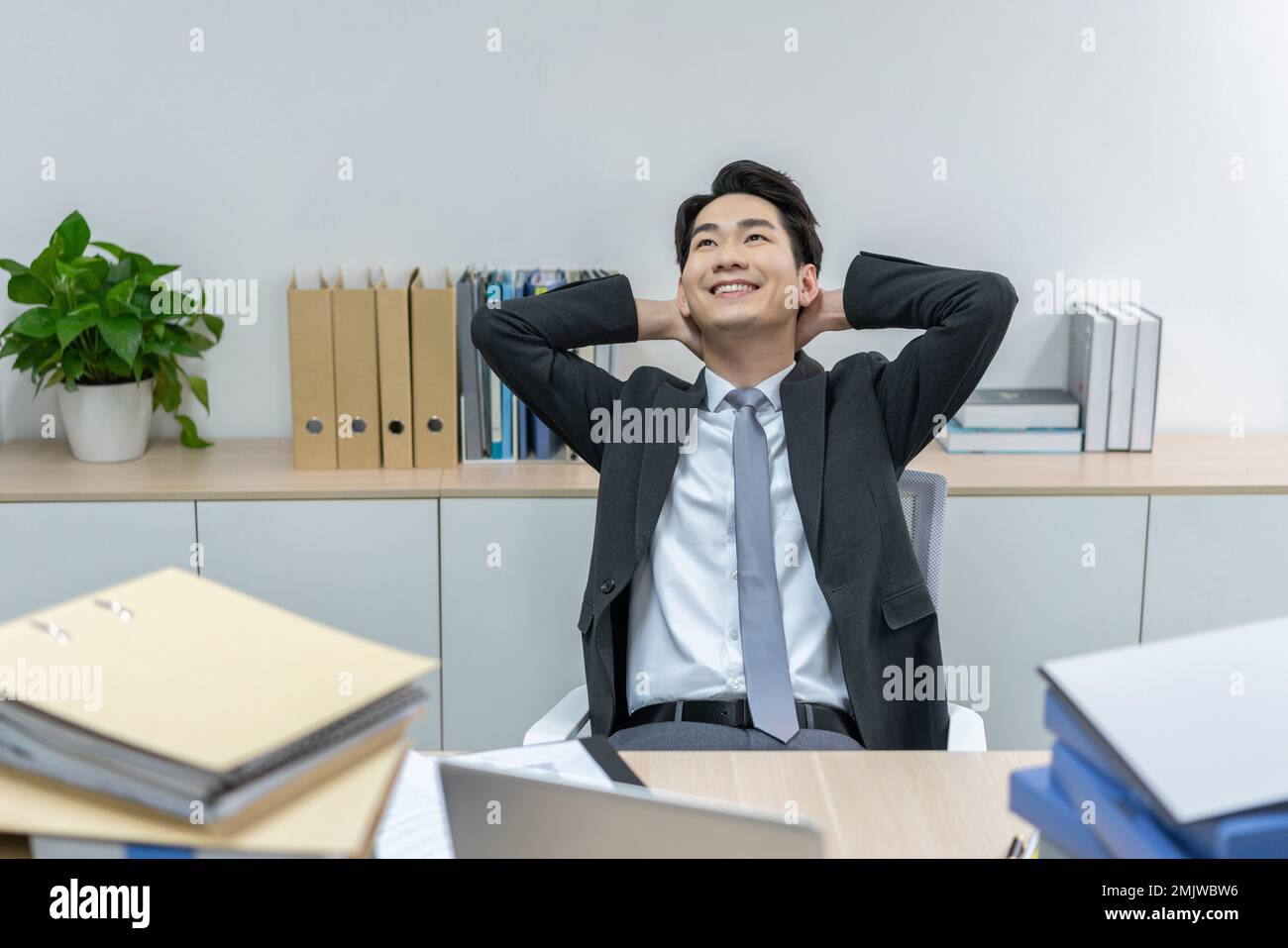 Happy business men in the office to work overtime Stock Photo - Alamy