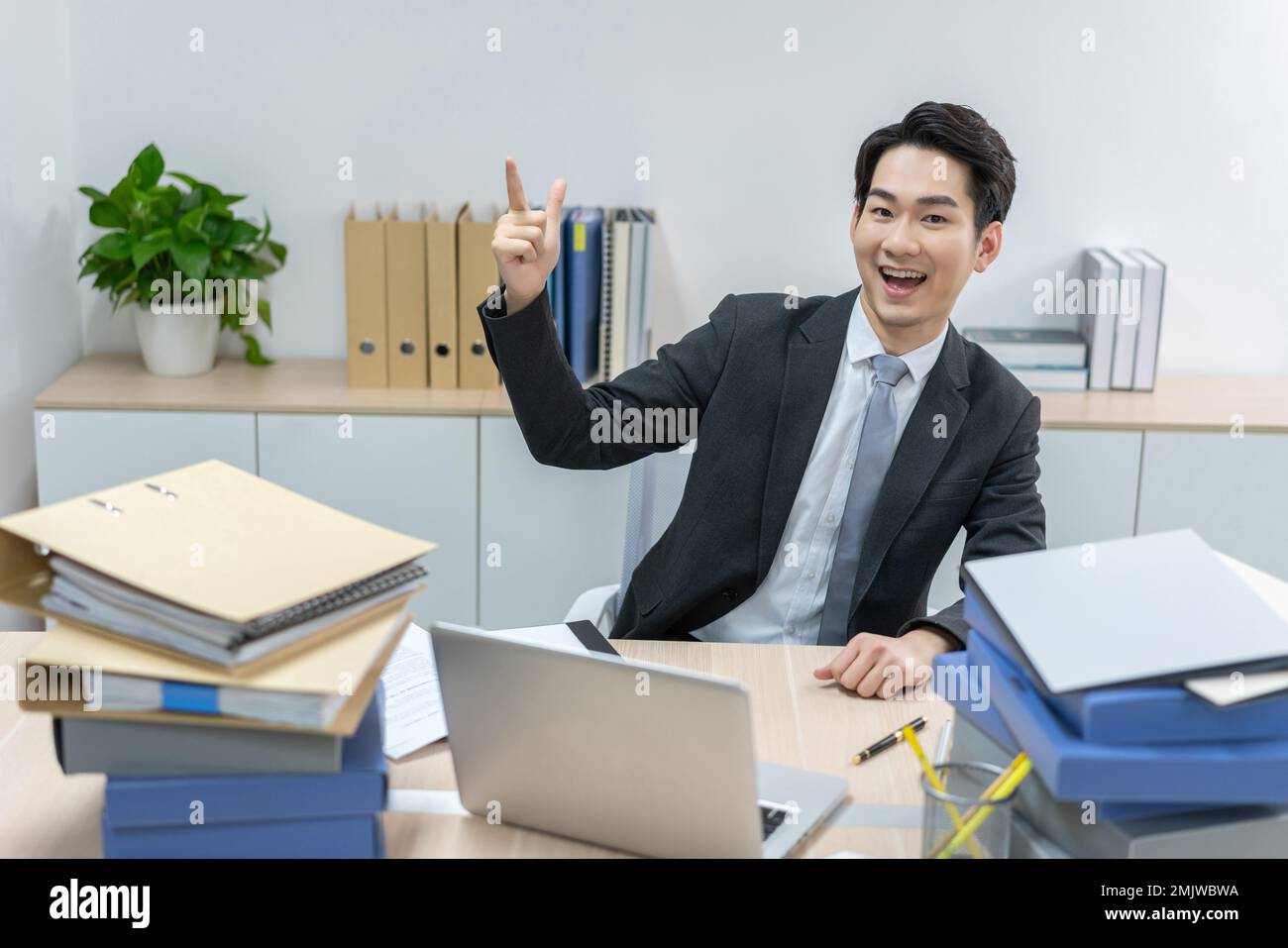 Happy business men in the office to work overtime Stock Photo - Alamy