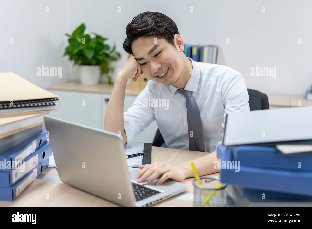 Happy business men in the office to work overtime Stock Photo - Alamy