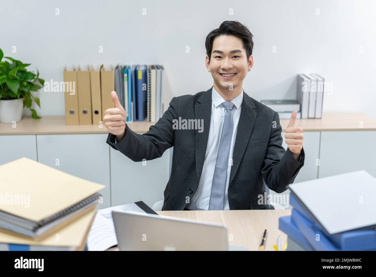 Happy business men in the office to work overtime Stock Photo - Alamy