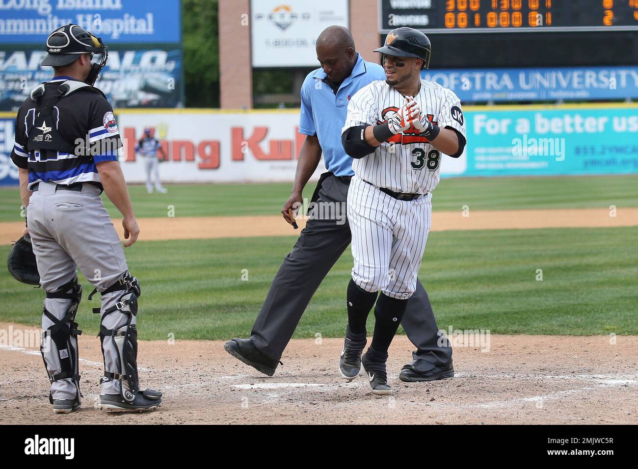 Long Island Duck's catcher Ramon Cabrera scores during an Atlantic ...