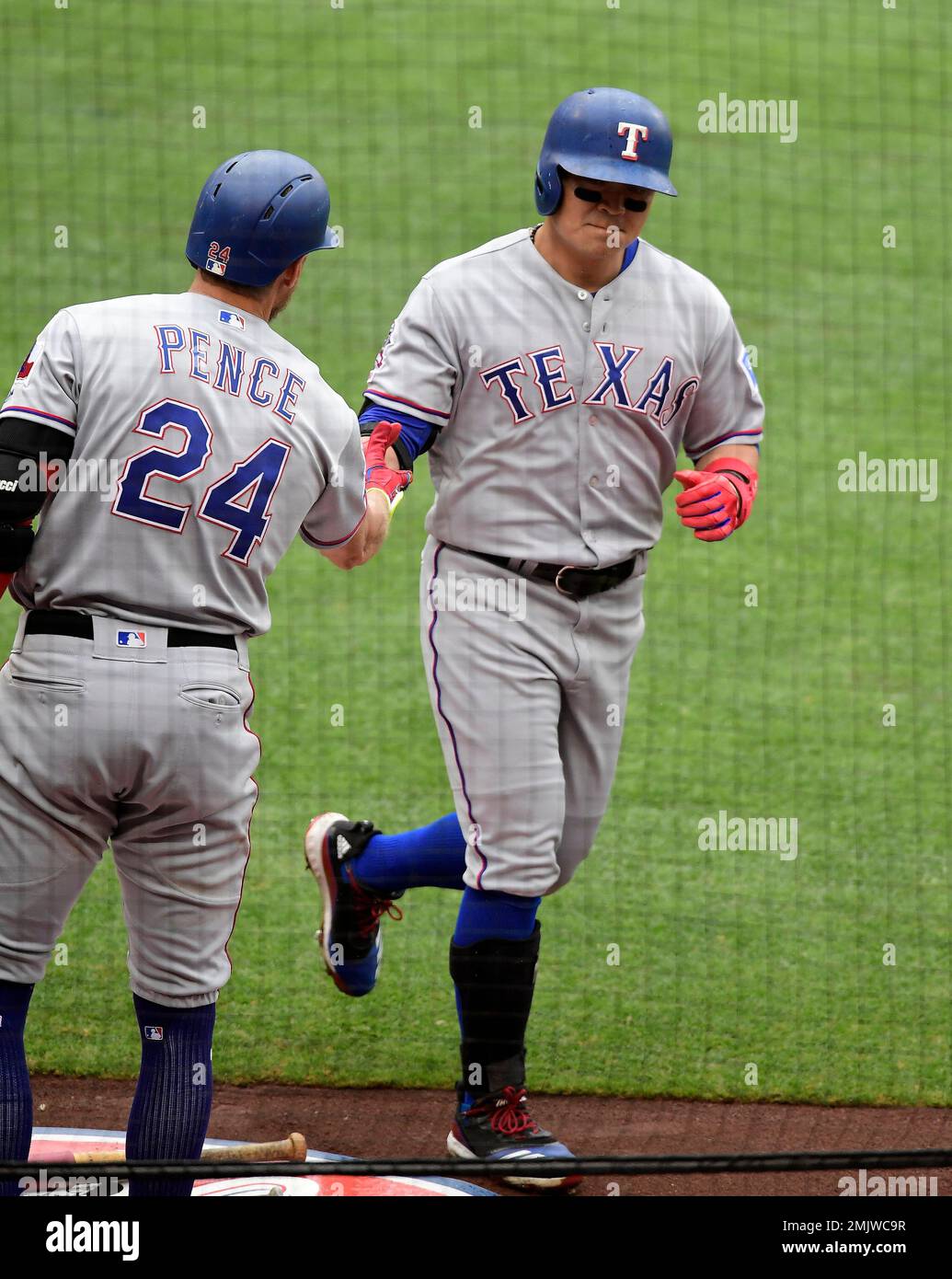 Texas Rangers' Shin-Soo Choo, right, is congratulated by Hunter Pence ...