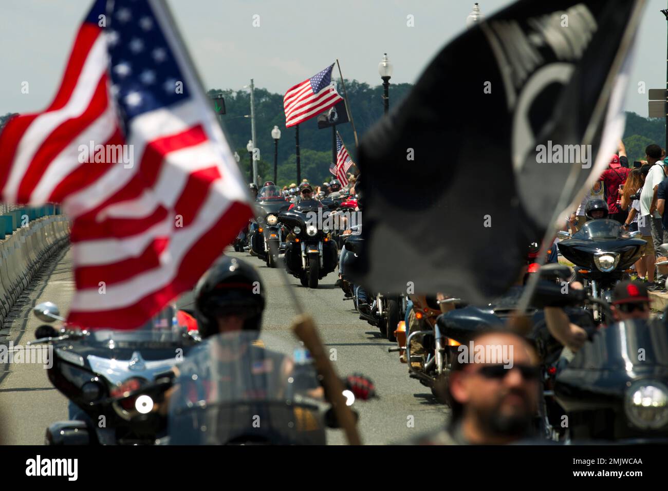 Participants in the Rolling Thunder motorcycle rally, ride past ...